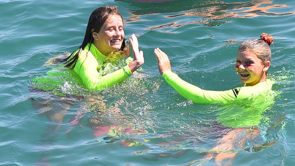 Dousing High Anxiety: Hundreds Leap from OB Pier