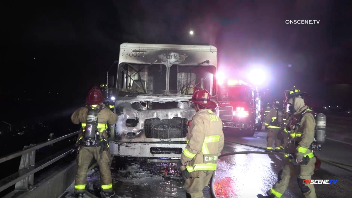 Truck Rolls 30 Feet as Firefighters Work to Control Blaze on I-805 ...