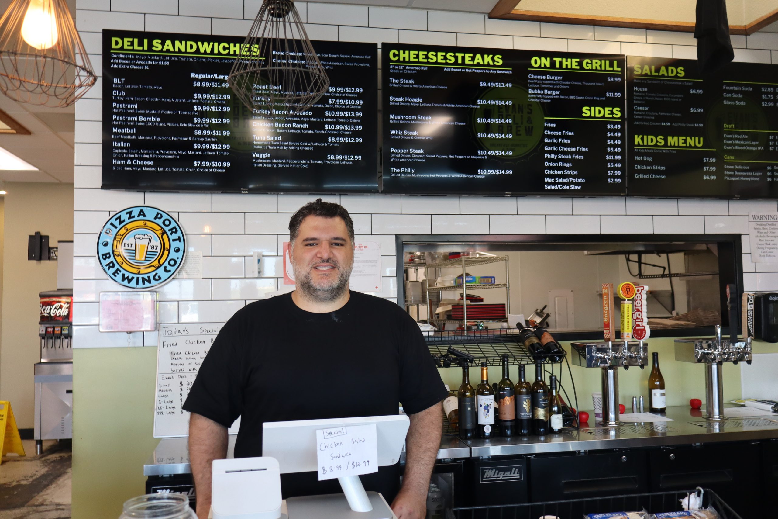 Sandwiches and cheesesteaks at Evan’s Deli & Brew in Midway District